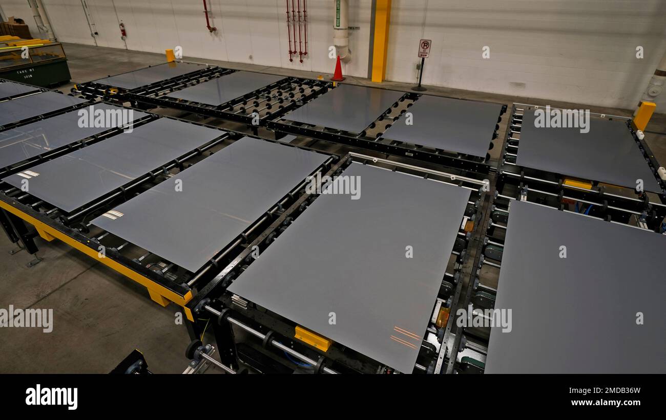 Solar panels are manufactured on the assembly line at the First Solar ...