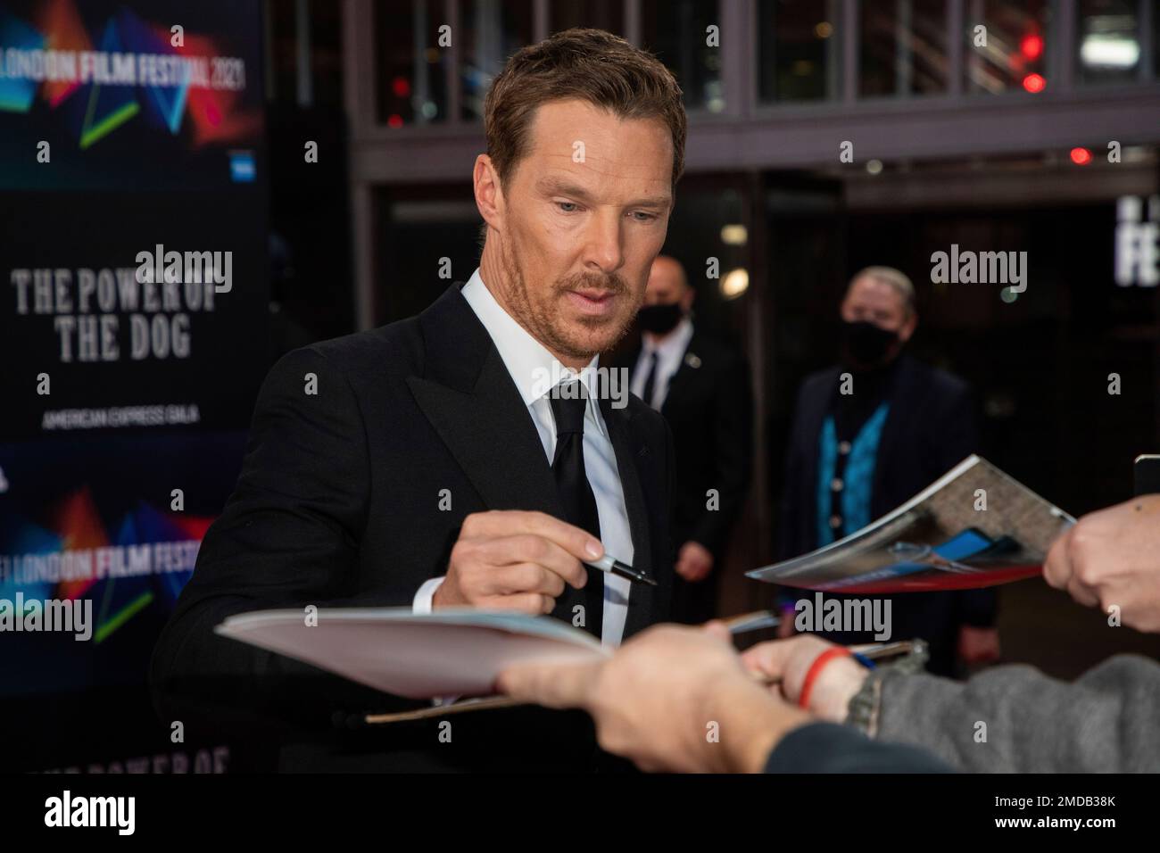 Benedict Cumberbatch signs autographs upon arrival at the premiere of ...