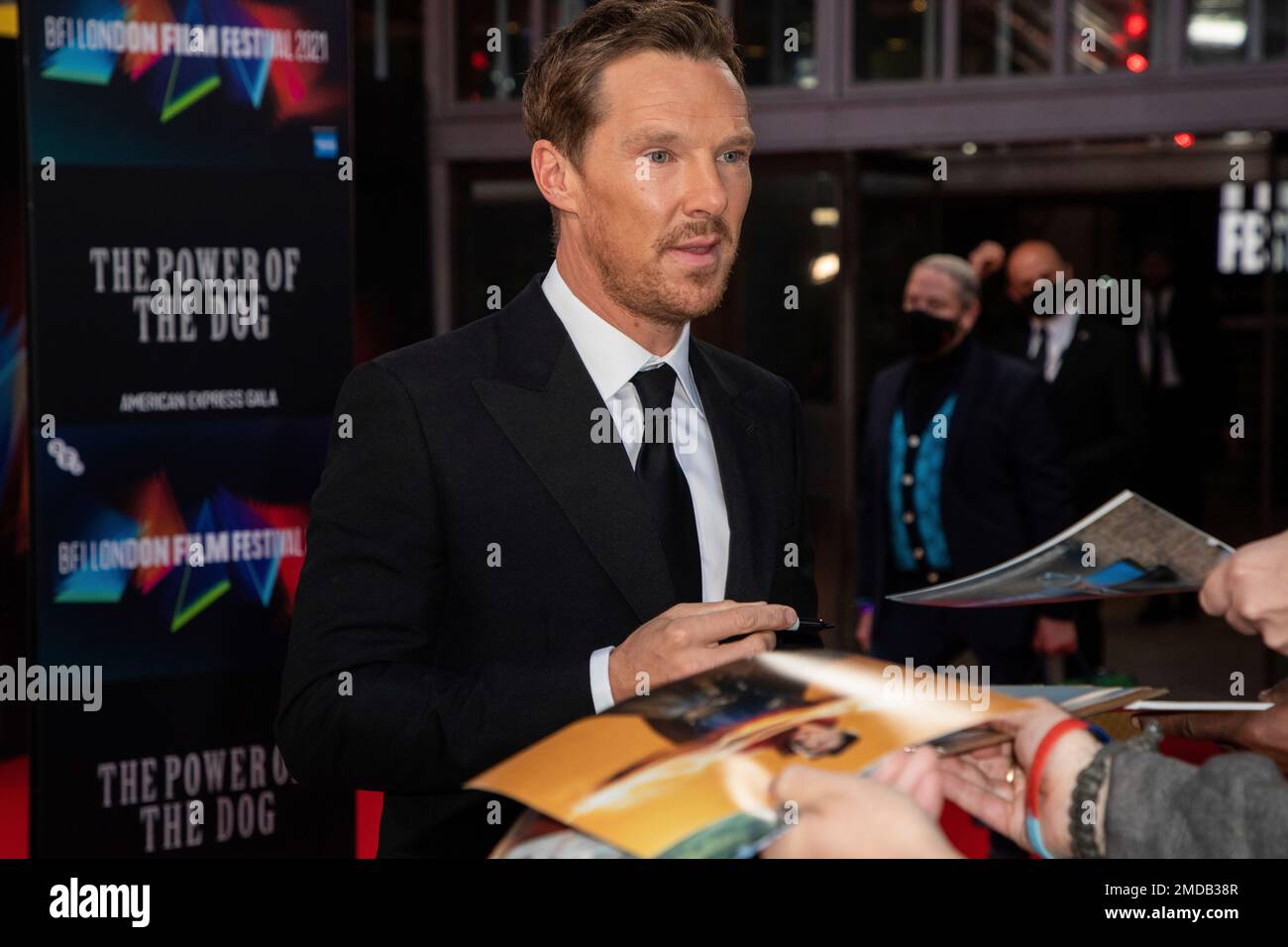 Benedict Cumberbatch signs autographs upon arrival at the premiere of ...