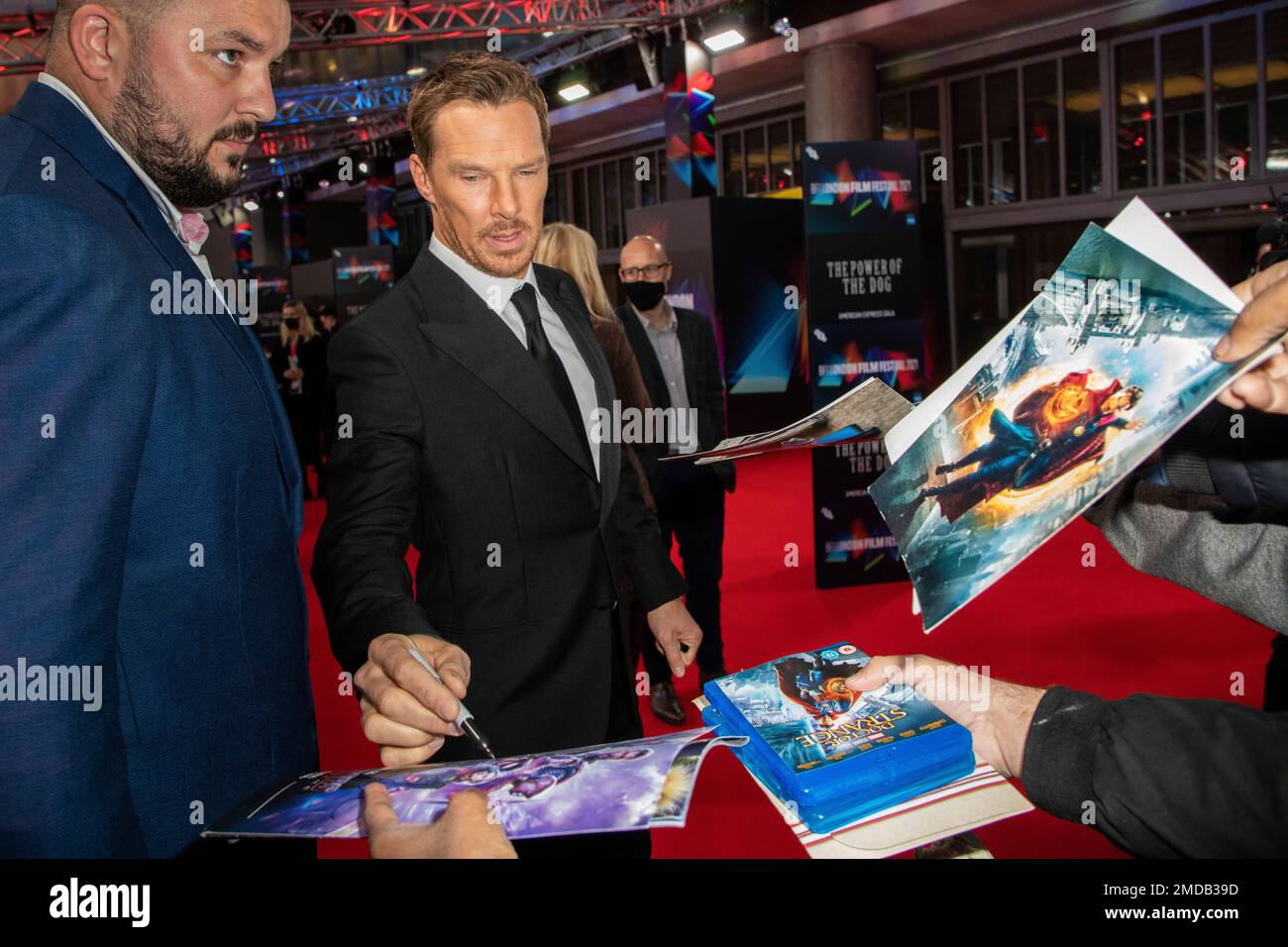 Benedict Cumberbatch signs autographs upon arrival at the premiere of ...