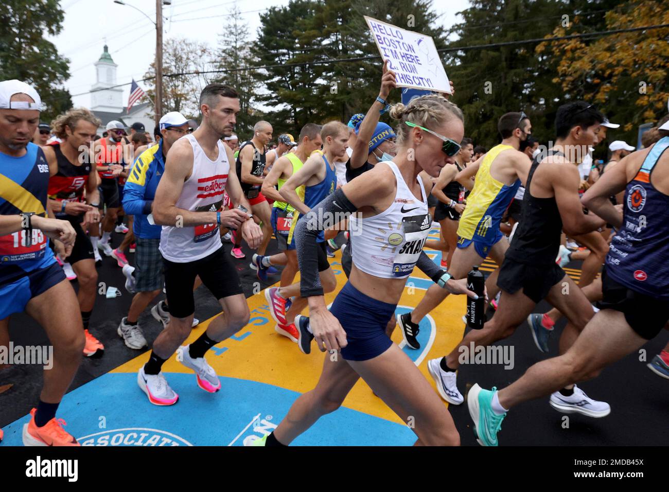 Shalane Flanagan crosses the starting line of the 125th Boston Marathon ...