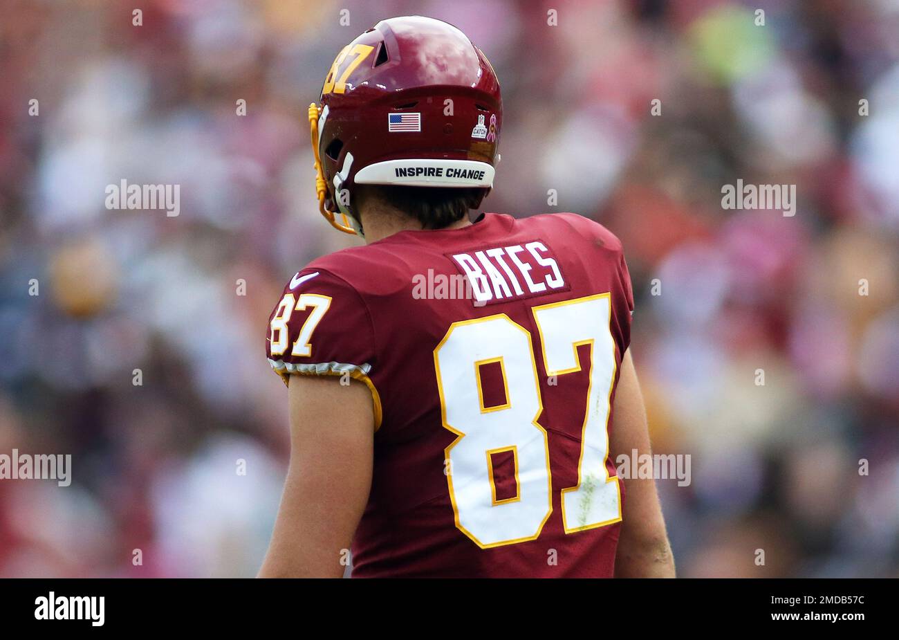 Washington Football Team tight end John Bates (87) dons a helmet saying ...