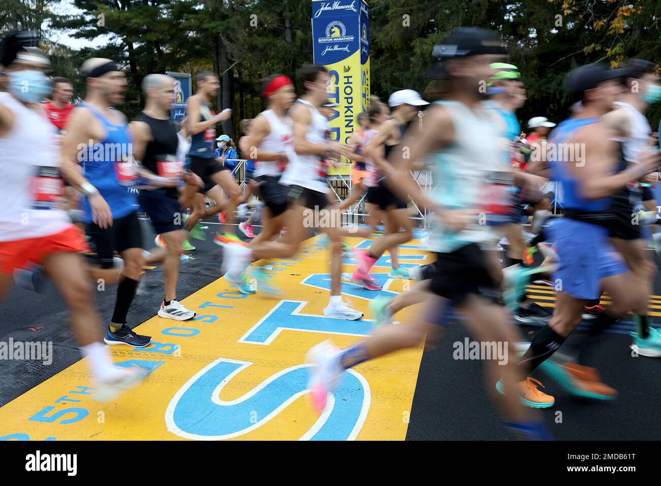 Runners cross the starting line of the 125th Boston Marathon, Monday ...