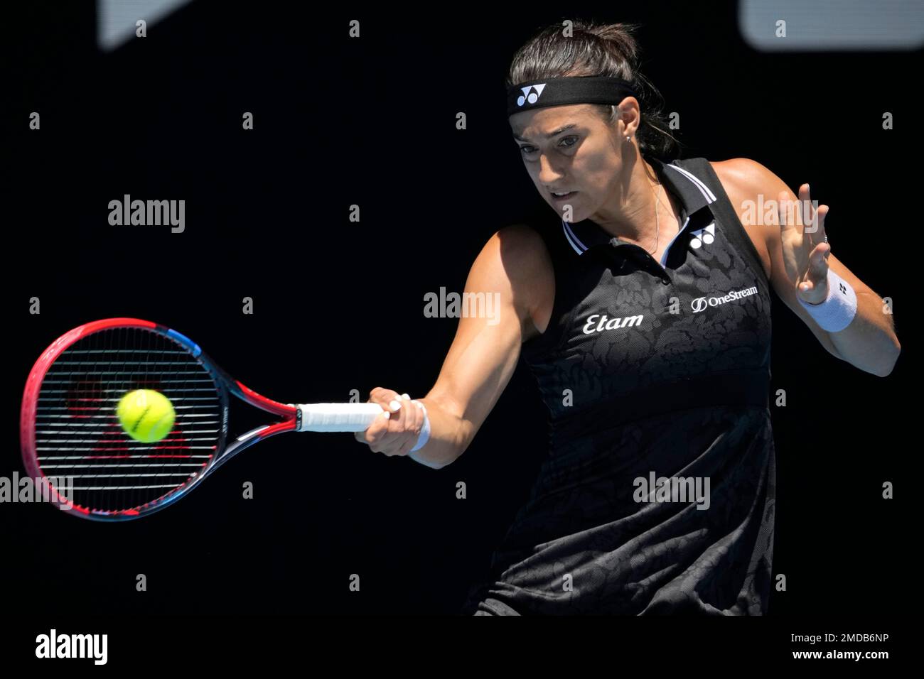 Caroline Garcia of France plays a forehand return to Magda Linette of ...