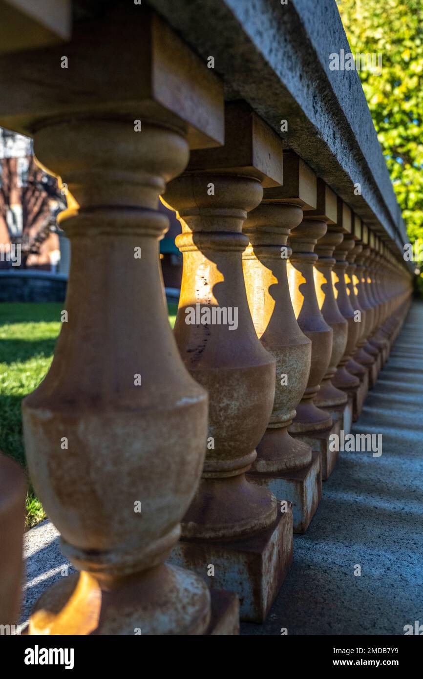 carved stone fence in front of the Victorian Mansion seperating the ...