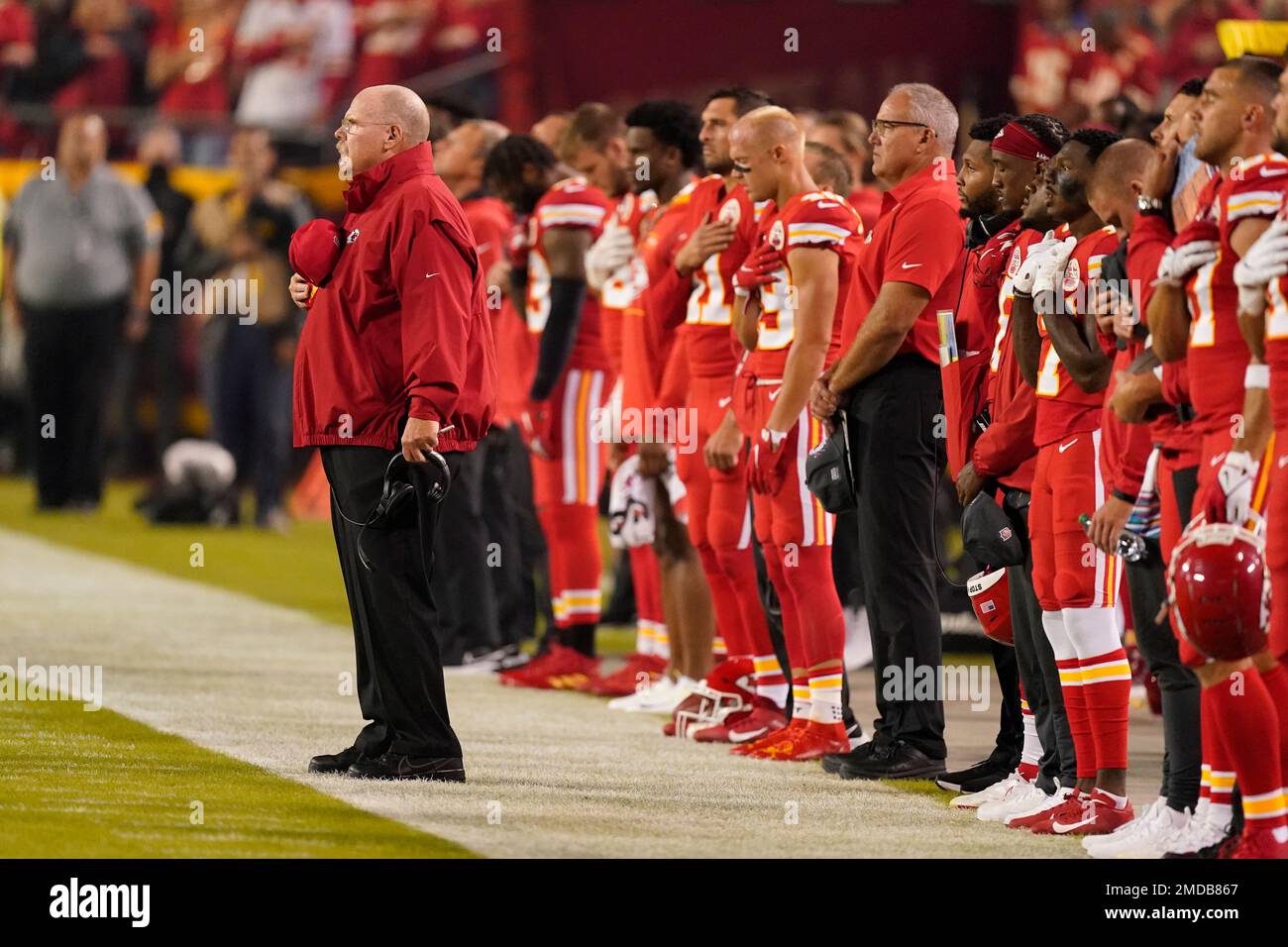 Kansas City Chiefs head coach Andy Reid stands for the national anthem ...