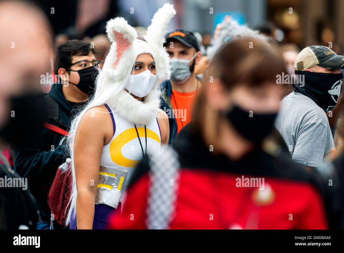 Attendees wear required face masks during New York Comic Con at the ...