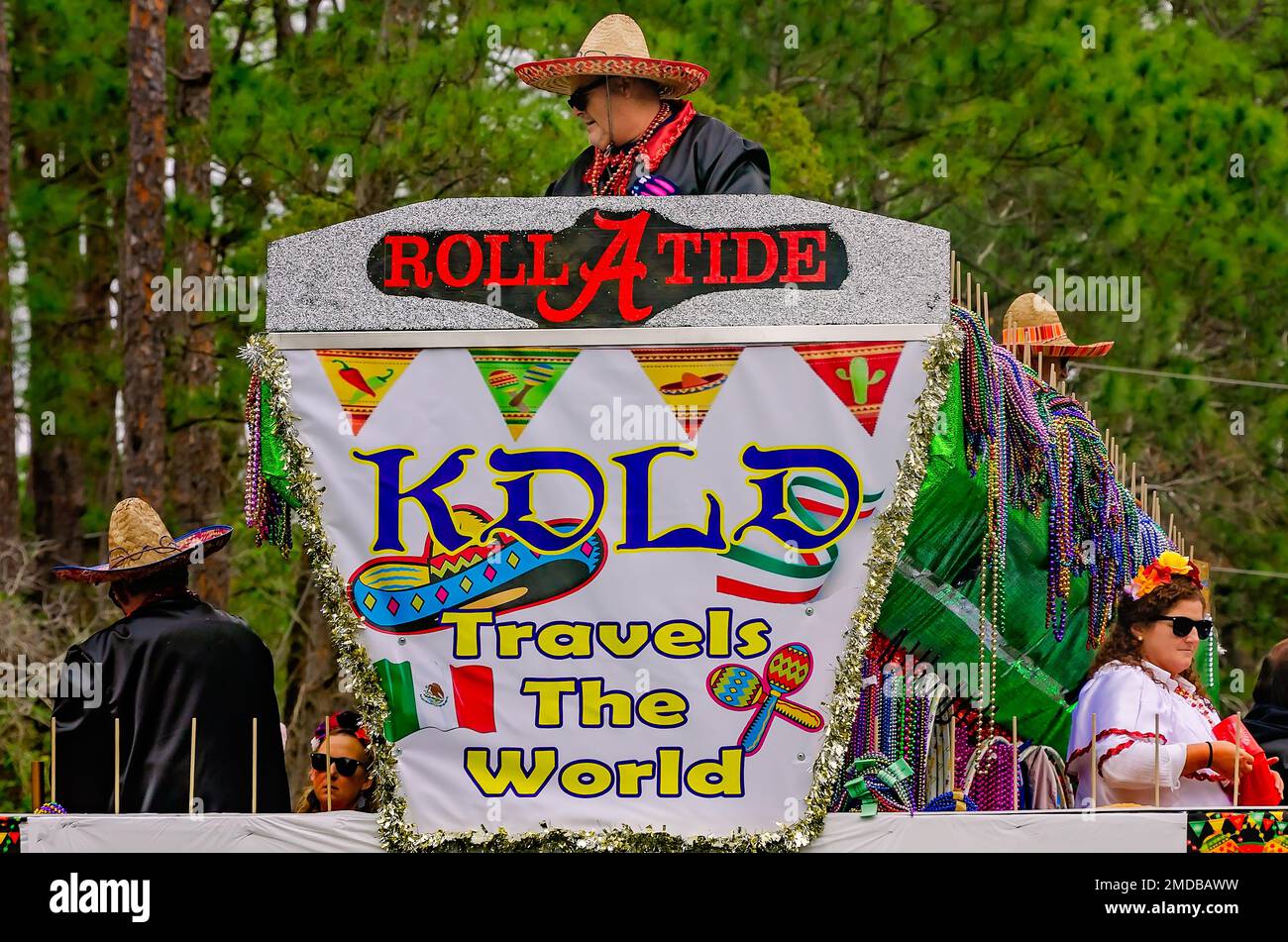 Members Of Krewe De La Dauphine Ride A Mardi Gras Float During The