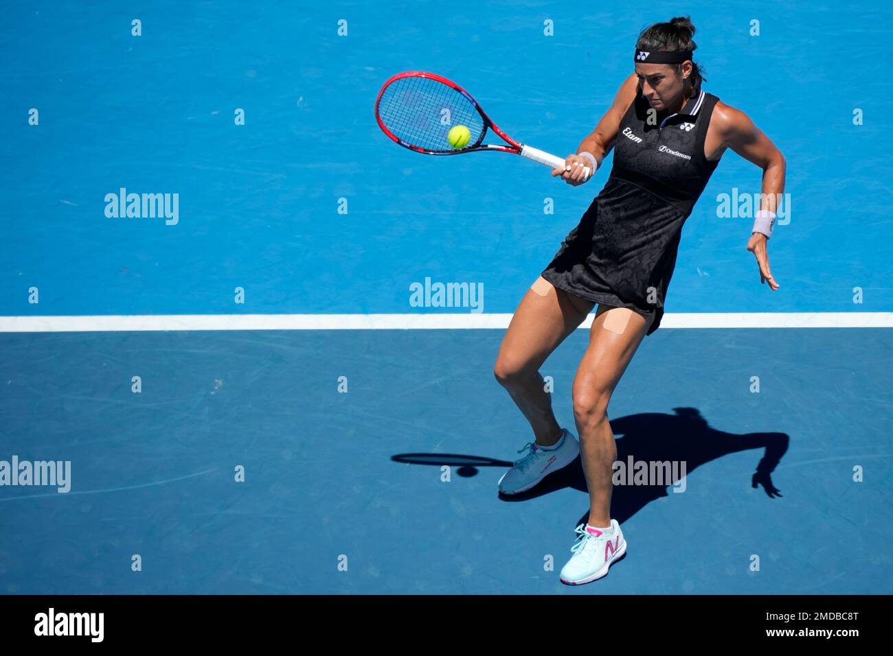 Caroline Garcia of France plays a forehand return to Magda Linette of ...