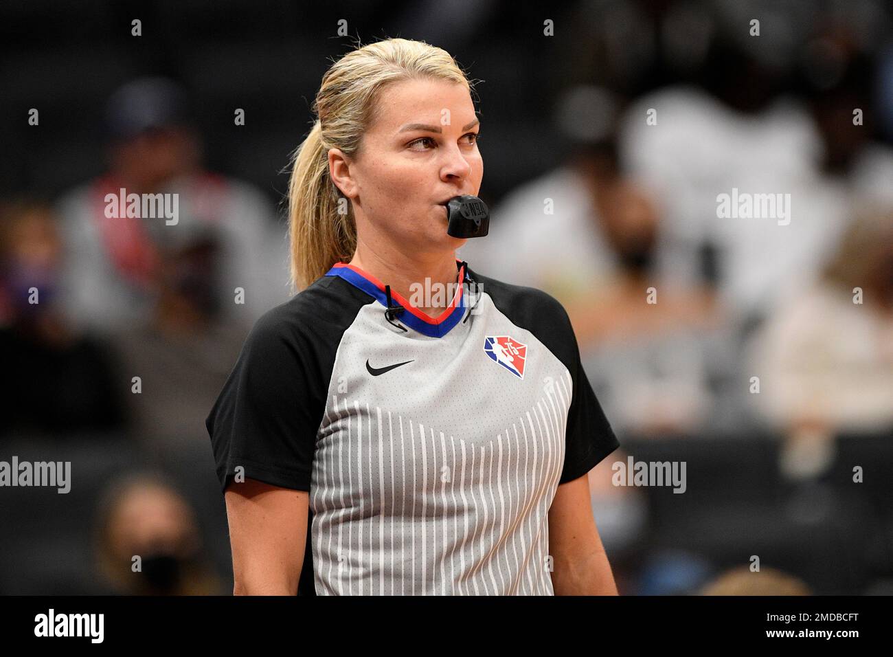 Referee Jenna Schroeder (84) stands on the court during the first half ...