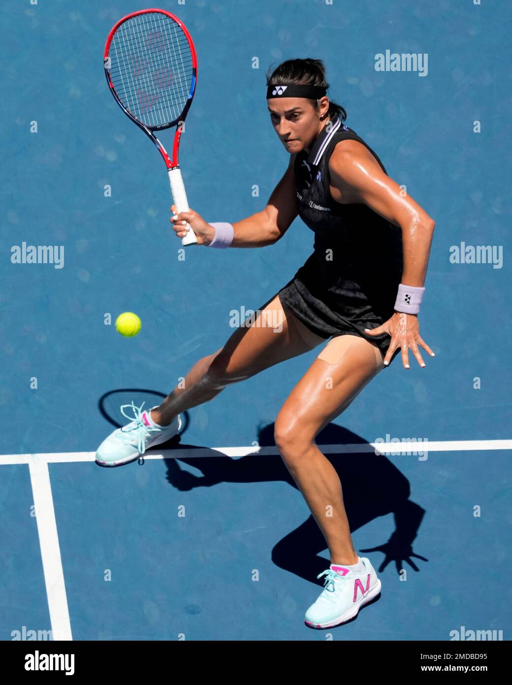 Caroline Garcia of France plays a forehand return to Magda Linette of ...