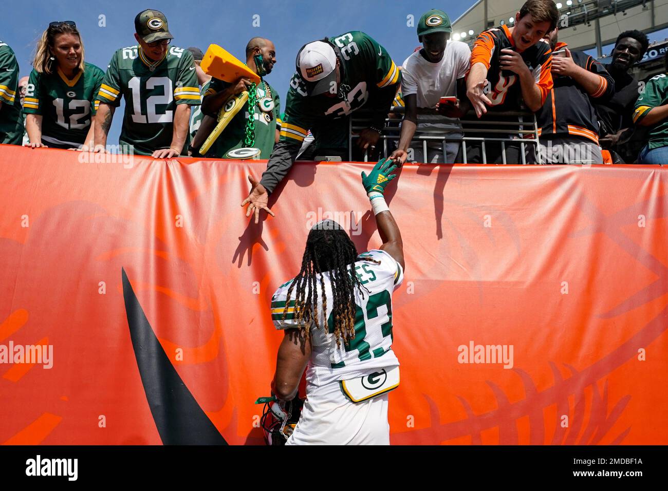 Green Bay Packers running back Aaron Jones (33) greets fans before an ...