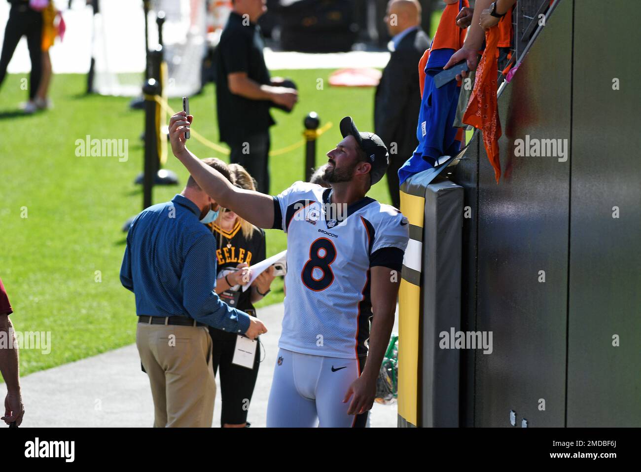 Denver Broncos kicker Brandon McManus (8) takes a selfie with fans ...