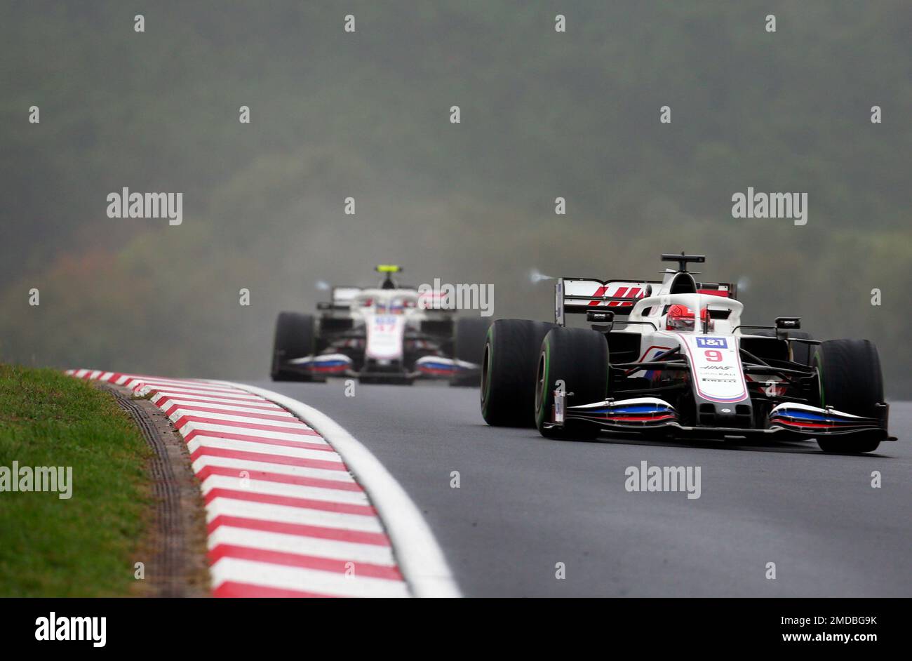 Haas driver Nikita Mazepin of Russia steers his car followed by Haas ...