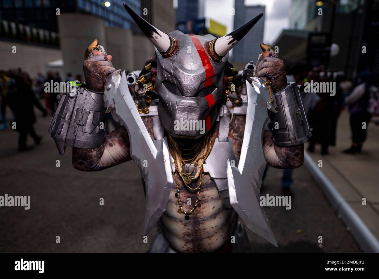 An attendee dressed as the Predator poses during New York Comic Con at ...