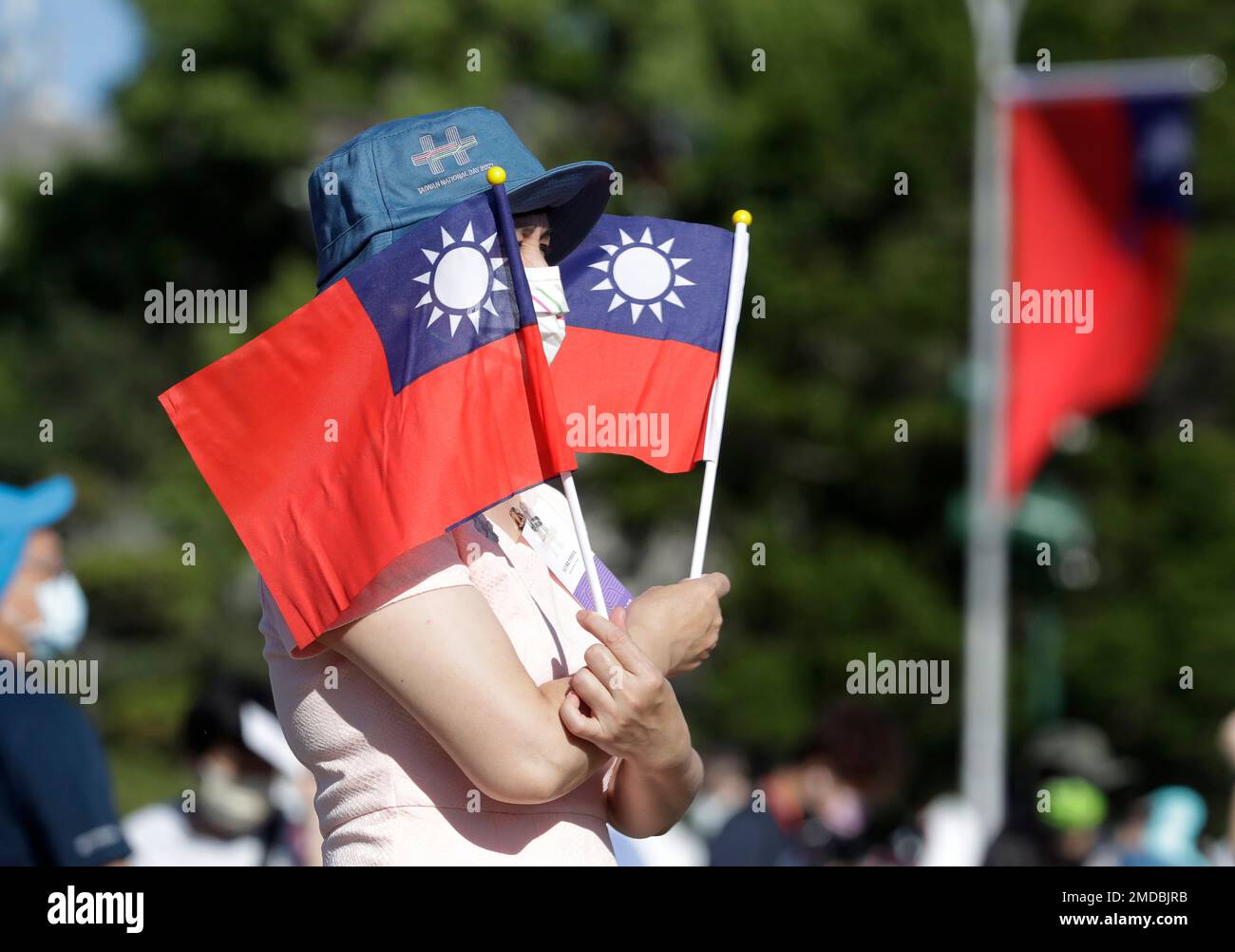 A woman takes a photo with Taiwan national flags during National Day ...