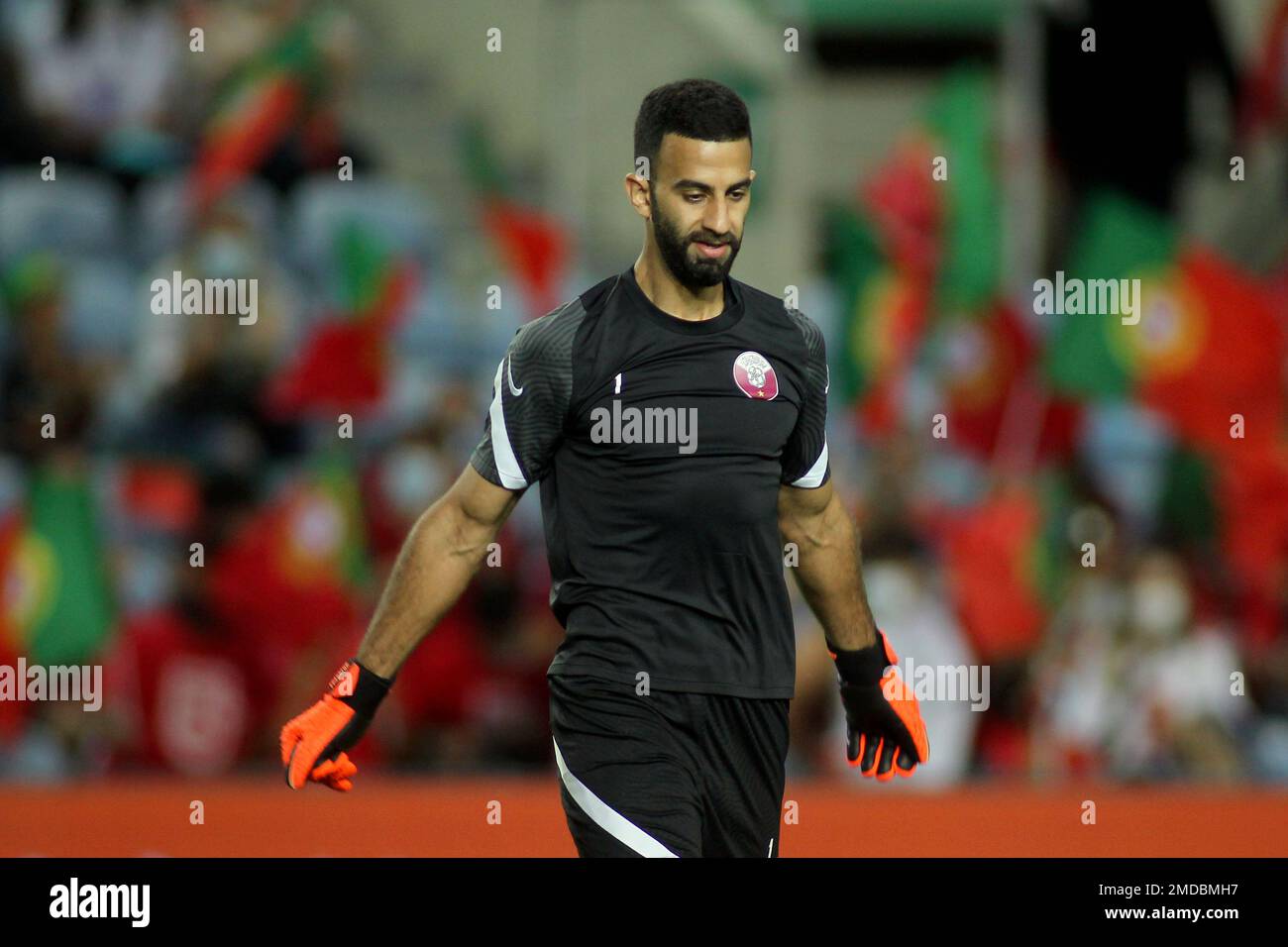Qatar goalkeeper Saad Al-Sheeb exercises during warmup before the ...