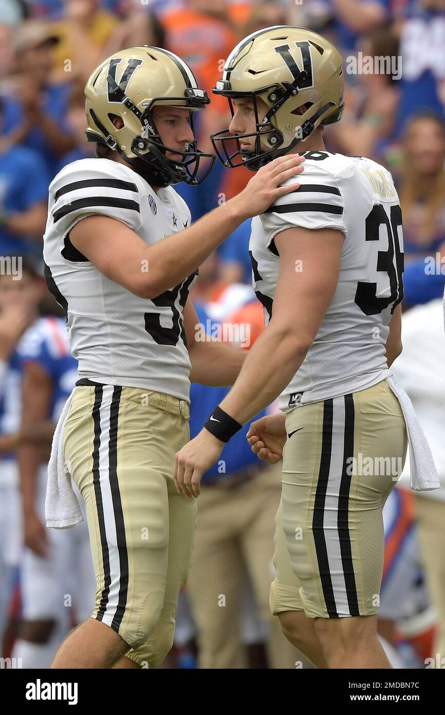 Vanderbilt place kicker Joseph Bulovas (36) is consoled by holder ...