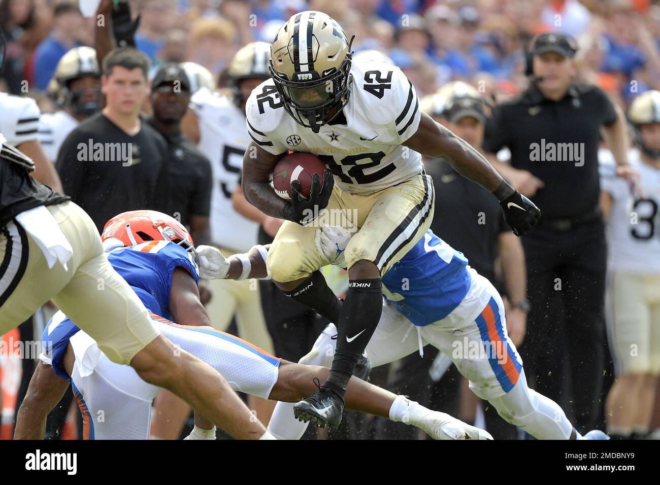 Vanderbilt running back Patrick Smith (42) rushes for yardage in front ...