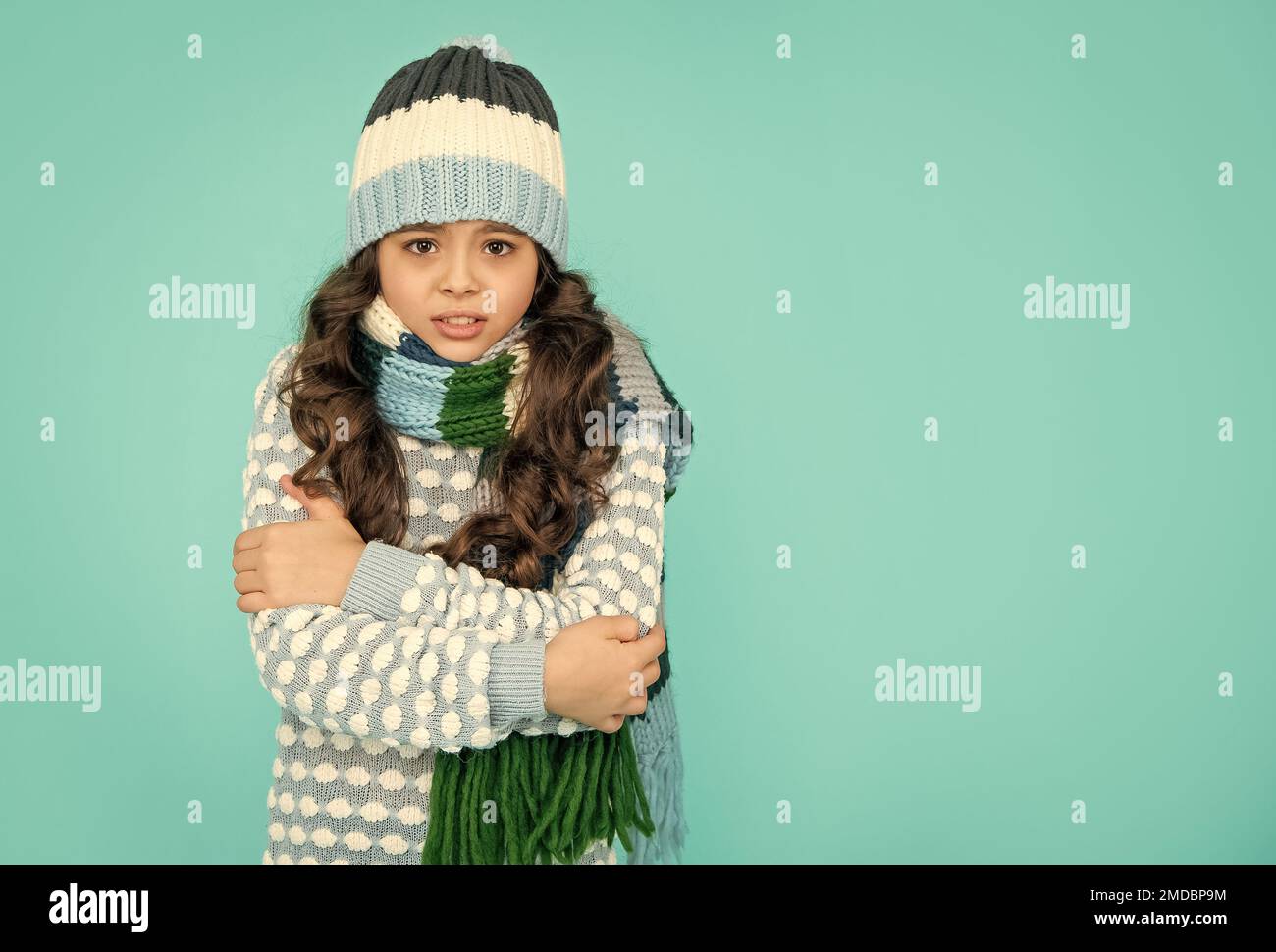 portrait of child wearing warm clothes. express emotion. winter fashion ...