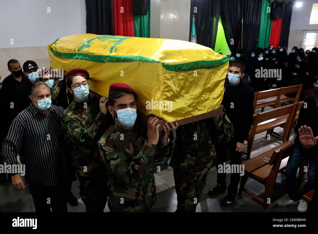Hezbollah fighters carry the coffin of Ali Atwa, a senior Hezbollah ...