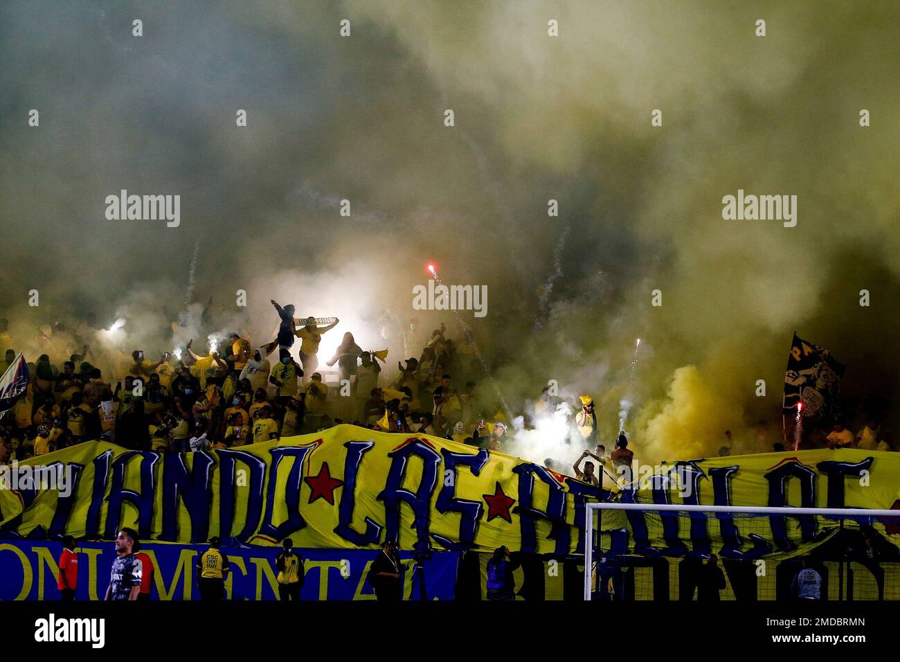 Colored smoke wafts from flares in the stands during the second half of ...