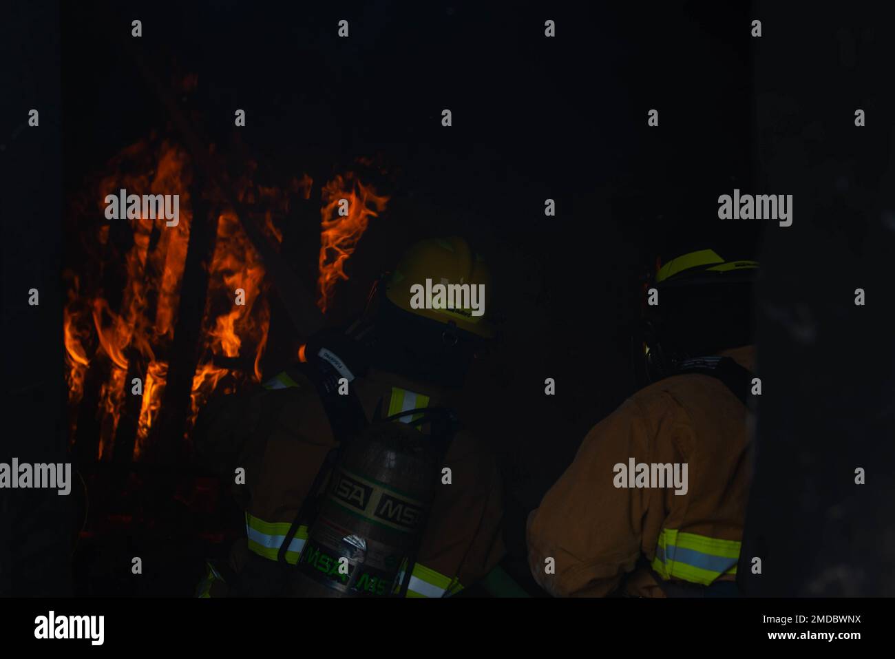 375th Civil Engineering Squadron firefighters put out a simulated ...