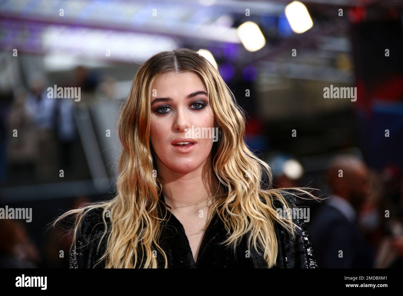 Honor Swinton Byrne poses for photographers upon arrival at the ...