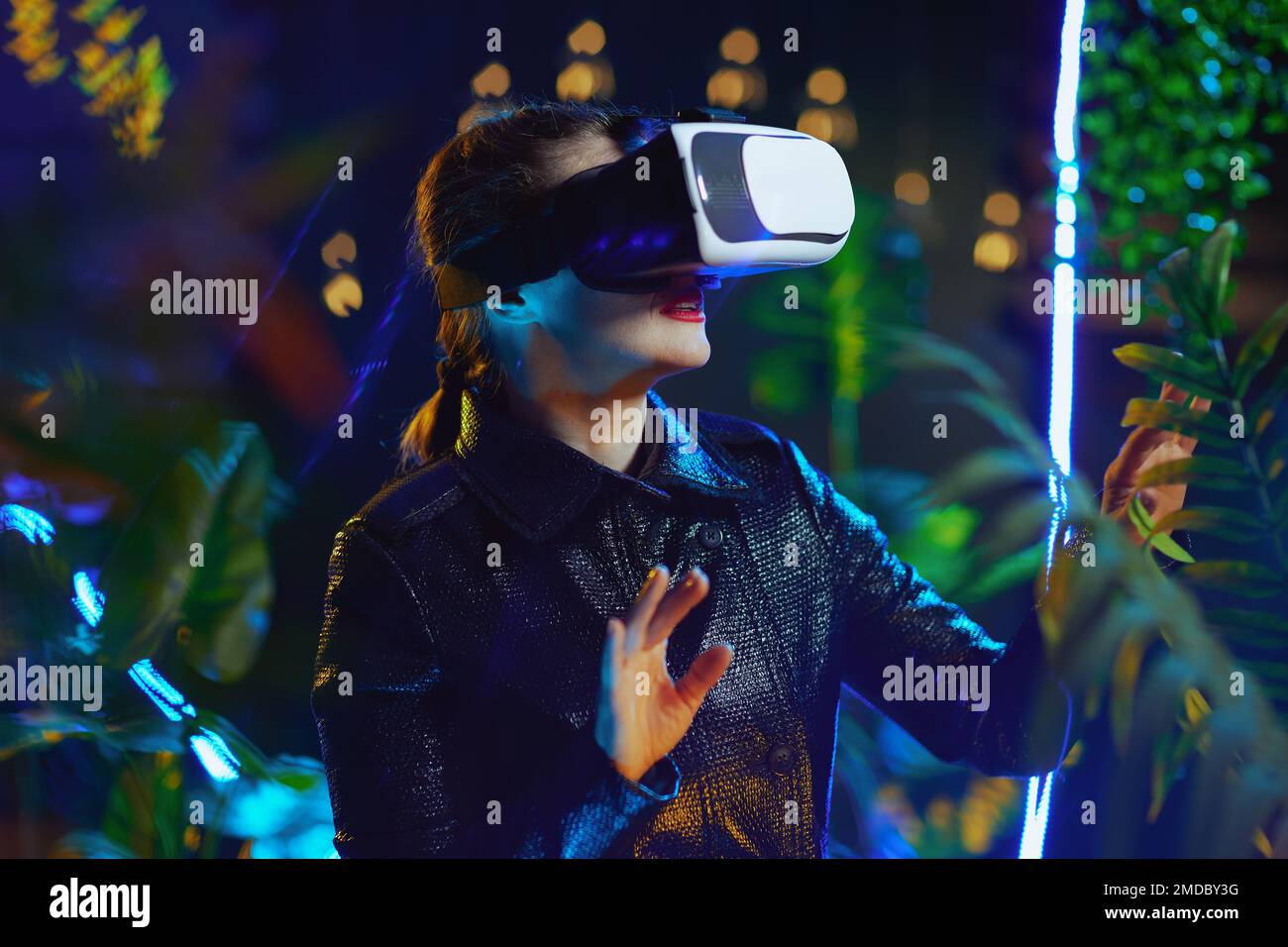 modern woman in metaverse in vr goggles exploring Stock Photo - Alamy