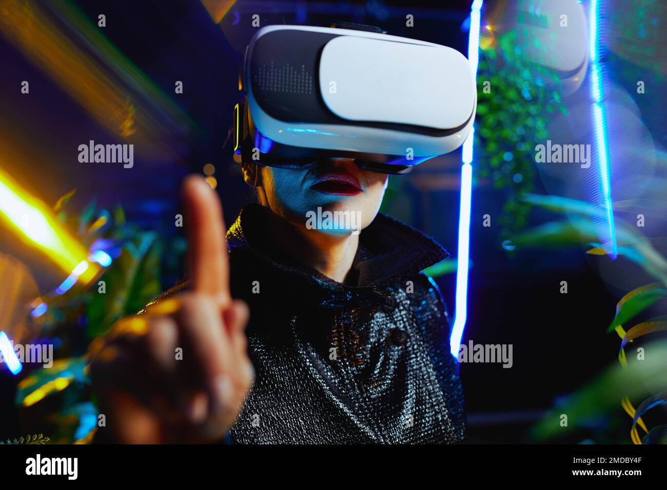 modern female in virtual reality in vr headset pressing the button in ...