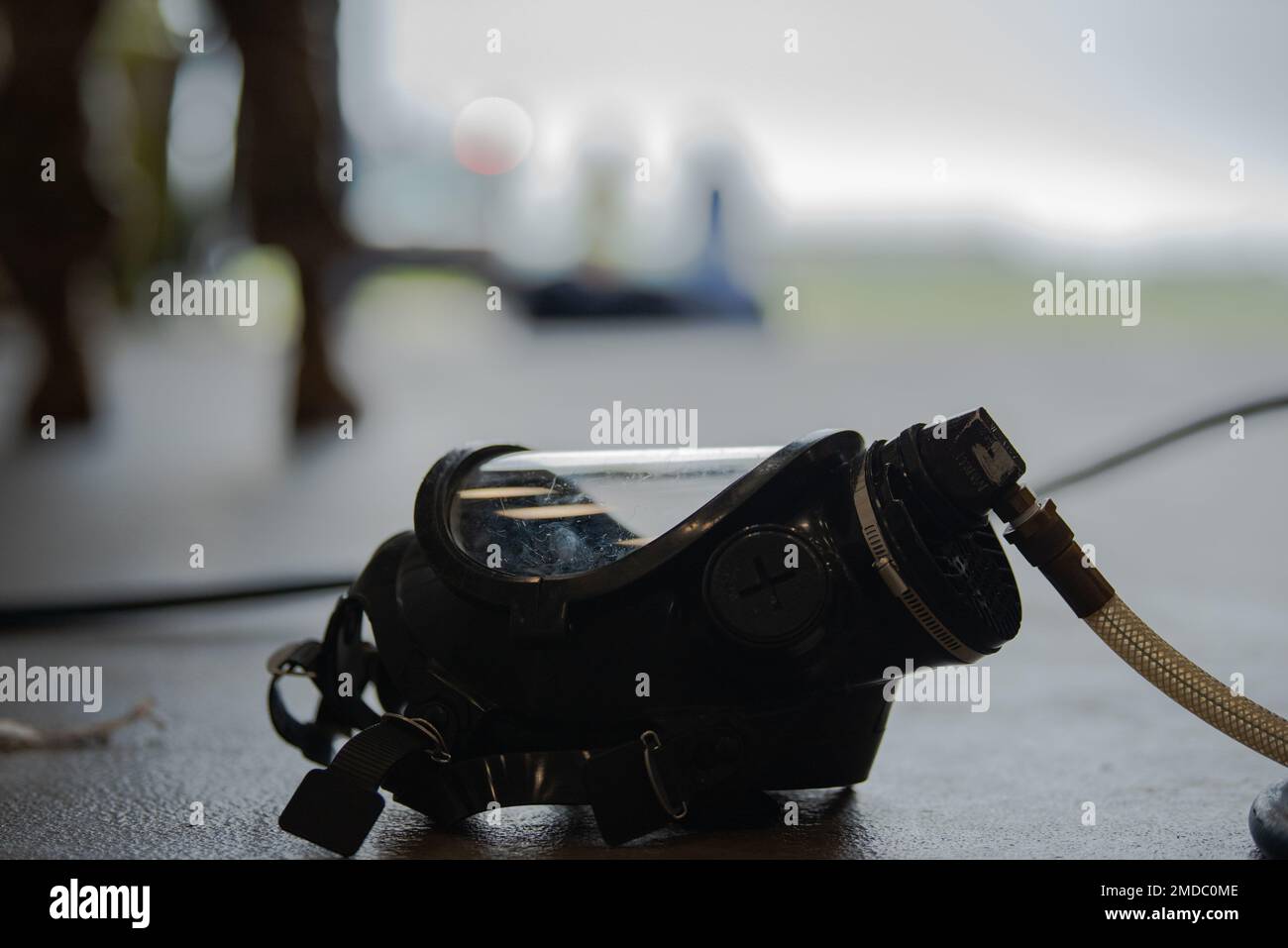 A protective oxygen mask lays on the ground during an extraction ...