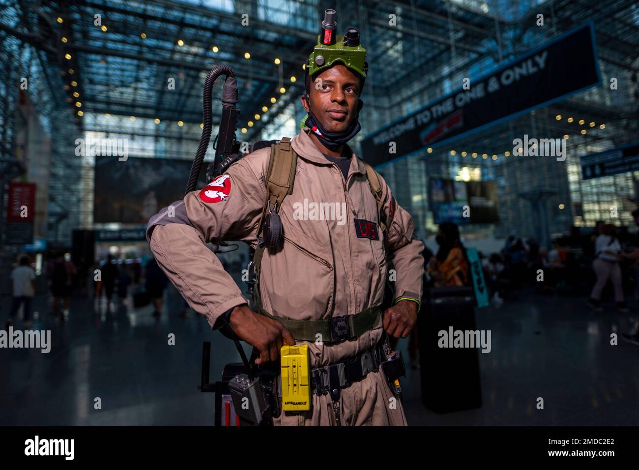 An attendee dressed as a Ghostbuster poses during New York Comic Con at ...