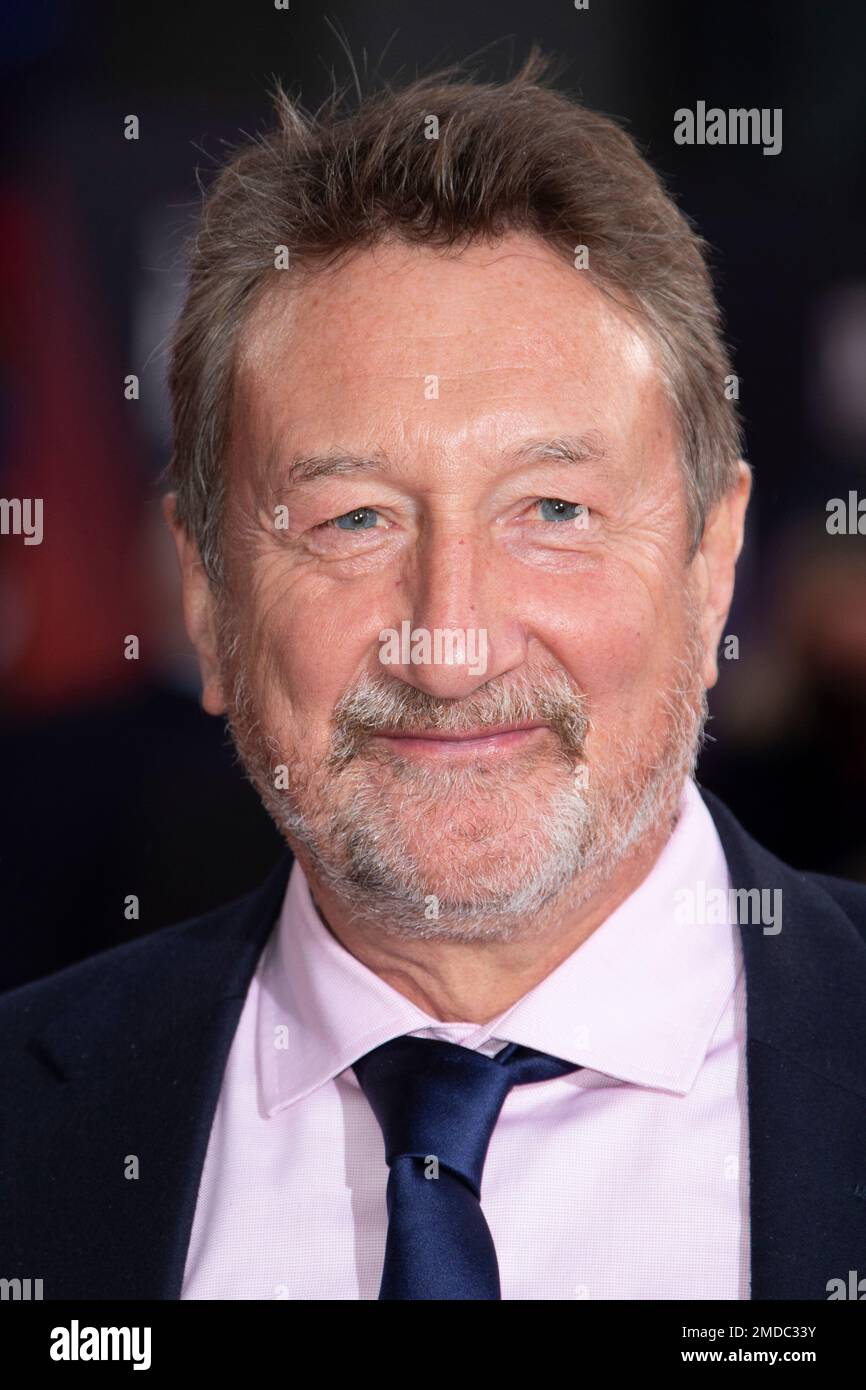 Steven Knight poses for photographers upon arrival at the premiere of ...