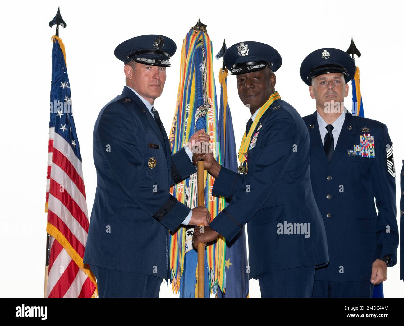 U.S. Air Force Col. Travolis A. Simmons, center, passes the 3rd Wing ...
