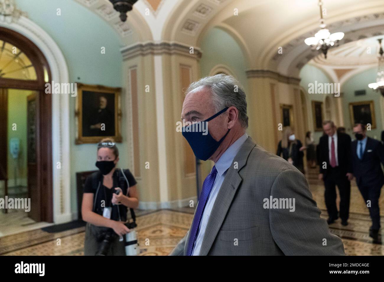 Sen. Tim Kaine, D-Va., walks from a policy luncheon on Capitol Hill ...