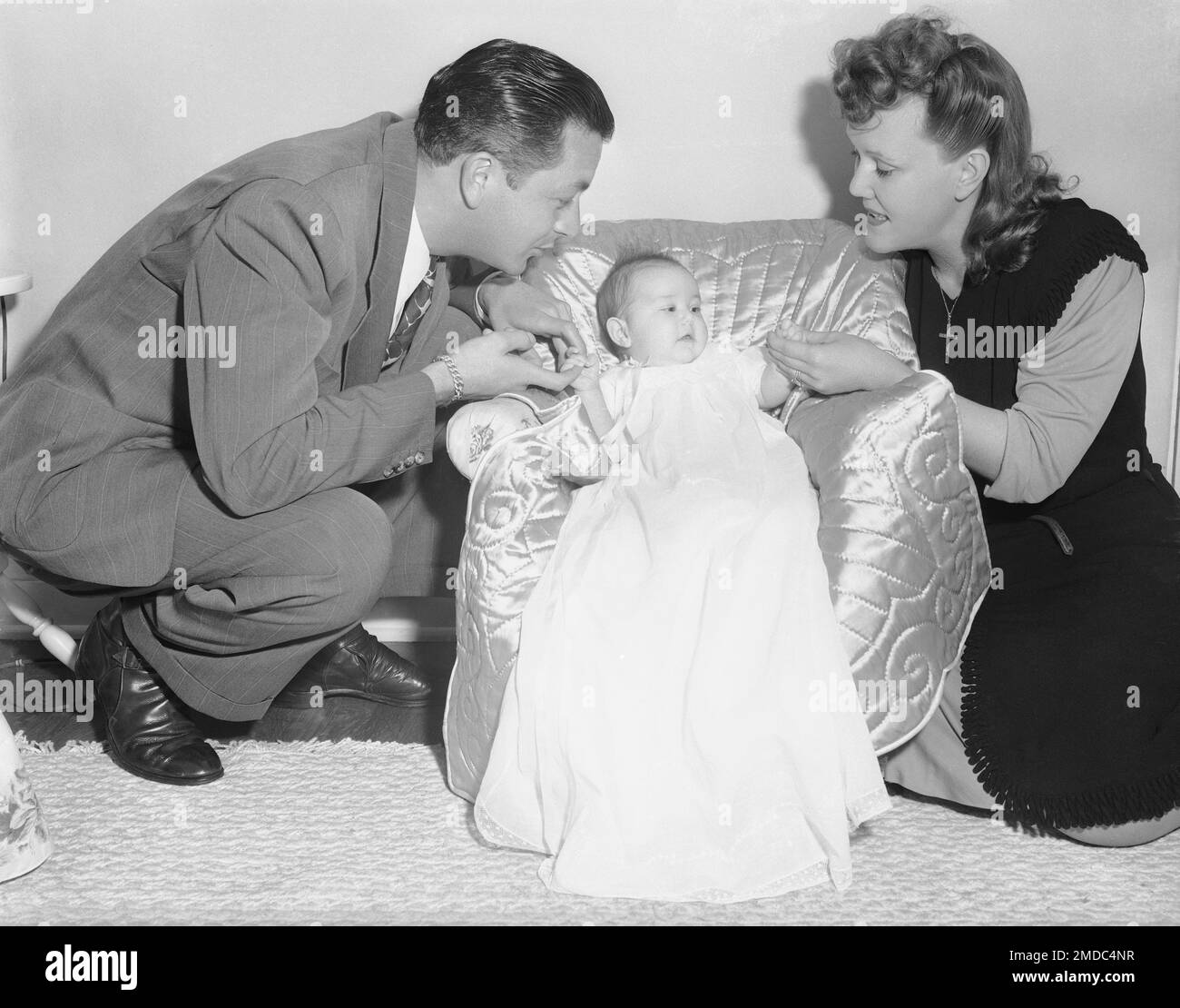 Actor Robert Young and his wife Betty coo at Betty Lou, youngest of the ...
