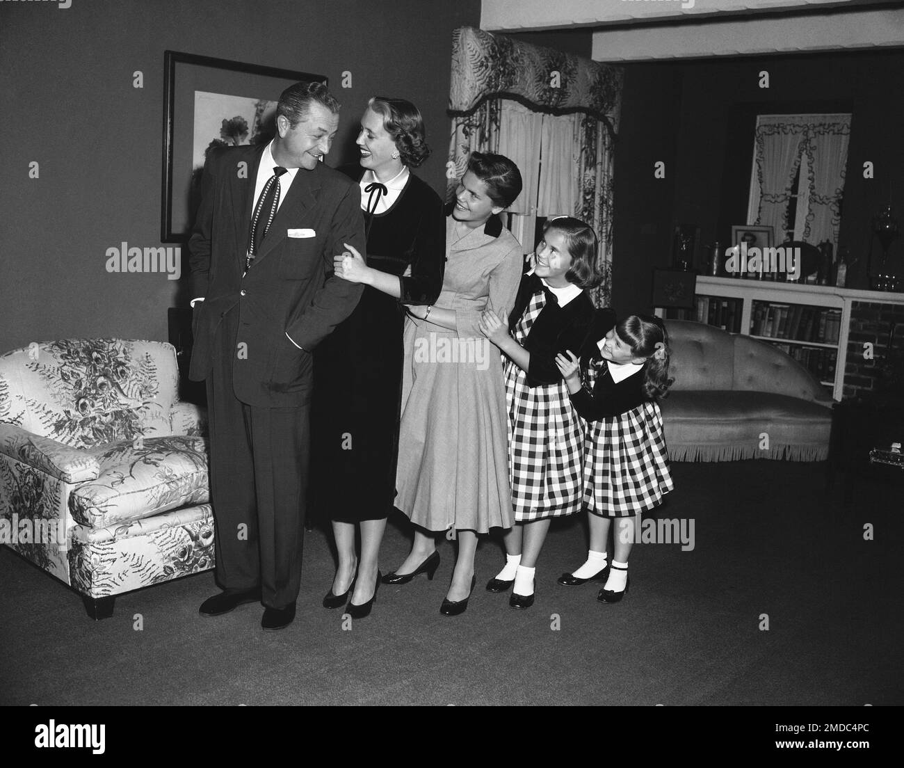 Robert Young, a family man in real life and on TV, lines up with his four daughters at their ...