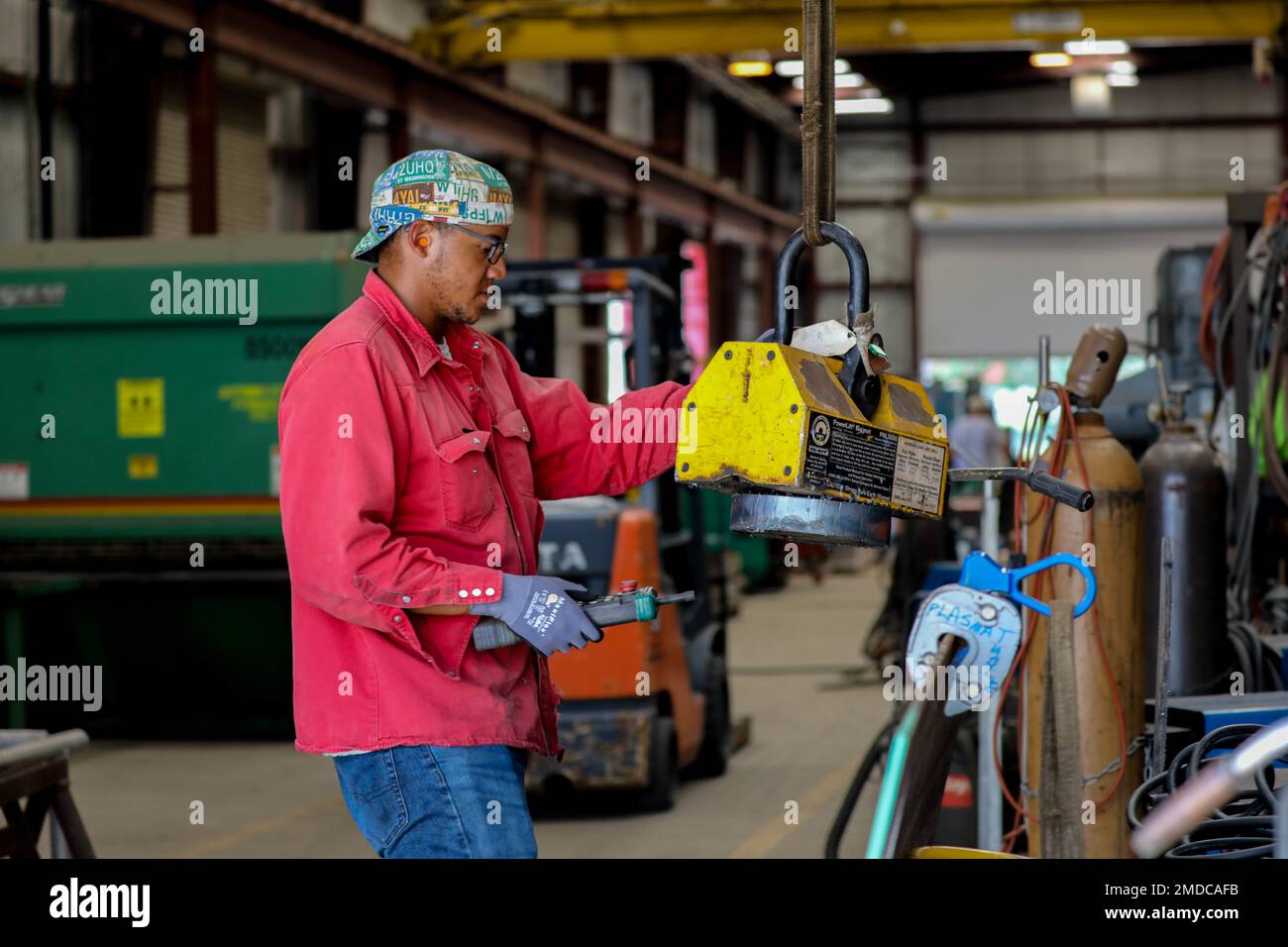 Michael Dunning Jr., a welder at the Army Corps of Engineers runs a ...