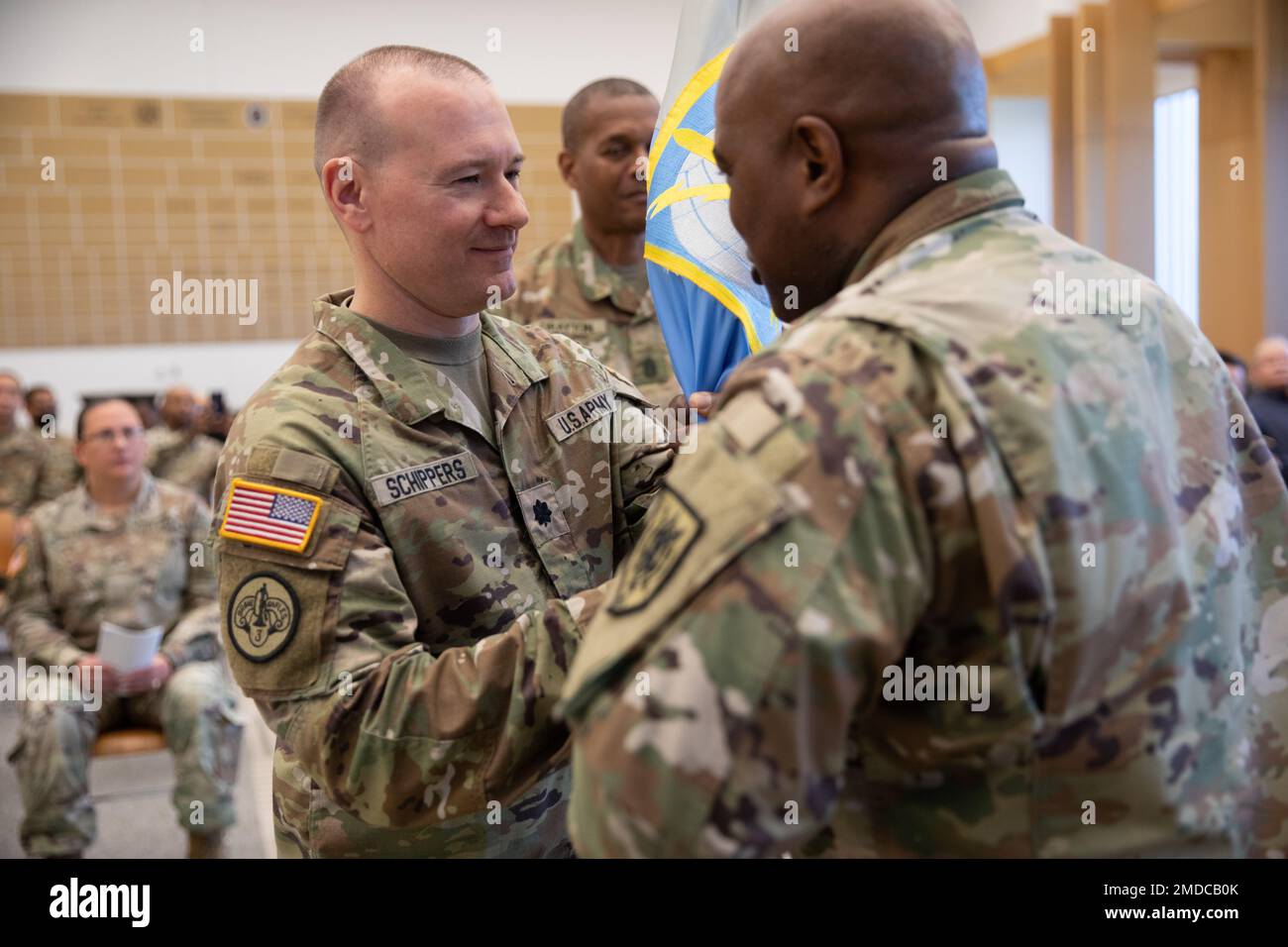 Lt. Col. Stephen Schippers (left) receives the colors of the Training ...