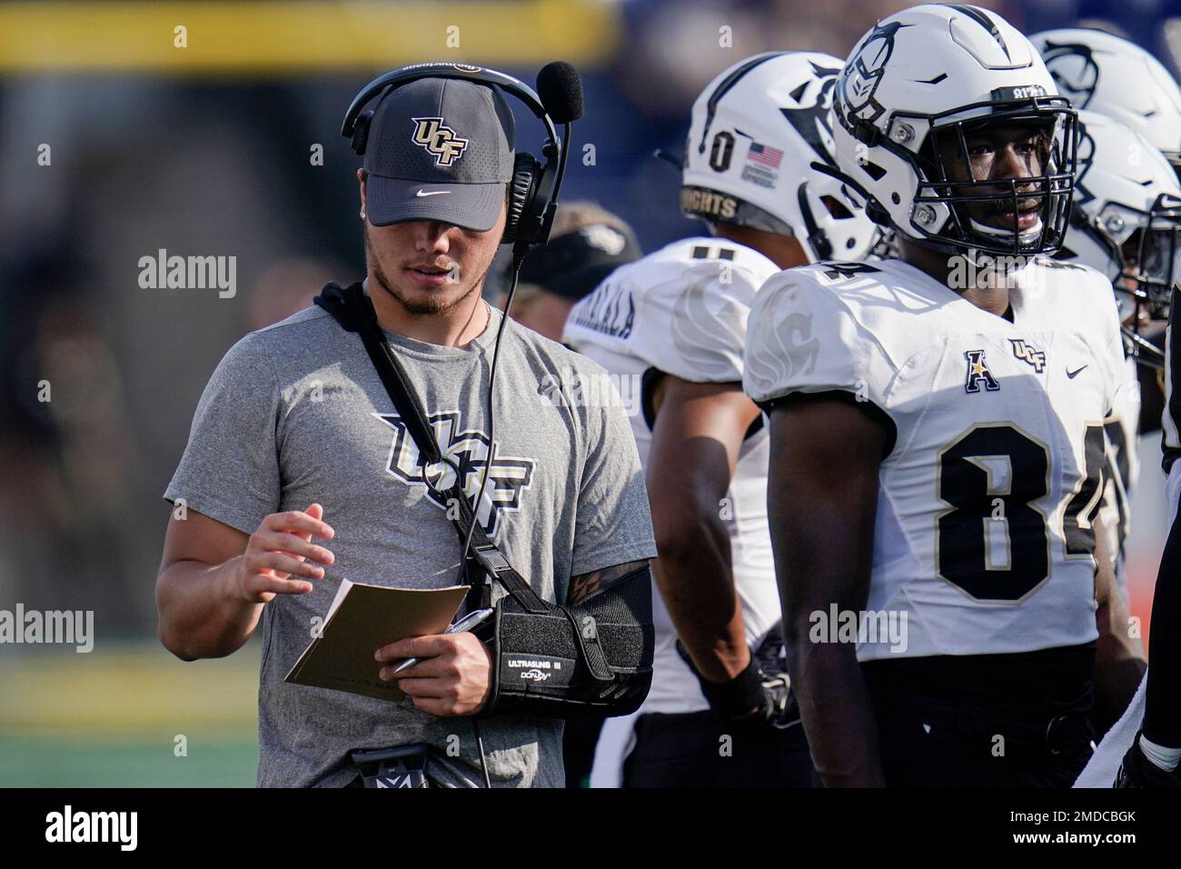 UCF quarterback Dillon Gabriel wears a sling while walking on the ...