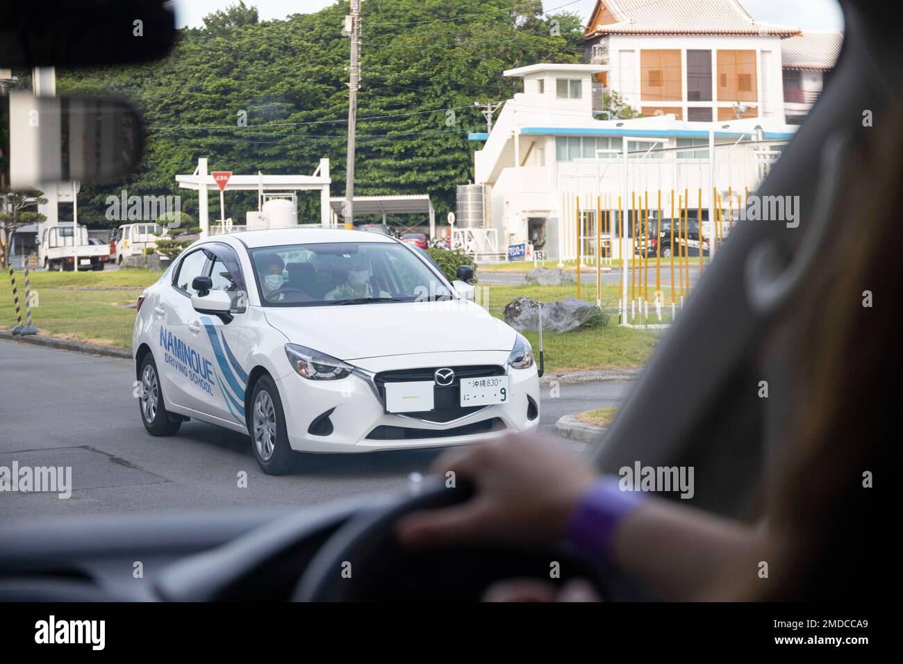 Participants of a DUI training event navigate through a driving ...