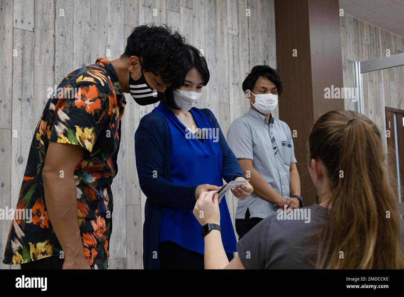 Participants compare differences in their driver’s licenses during a ...