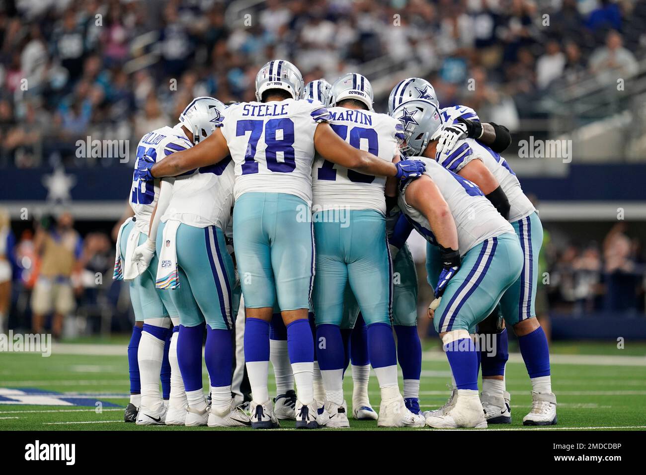 Dallas Cowboys offensive huddle with Terence Steele (78) with arms ...
