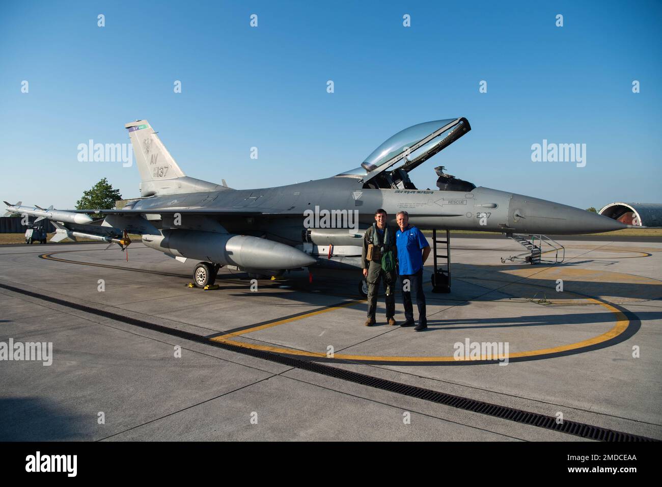 U.S. Air Force Capt. Jett Wright, 367th Fighter Squadron F-16 Fighting Falcon pilot, left, and ...