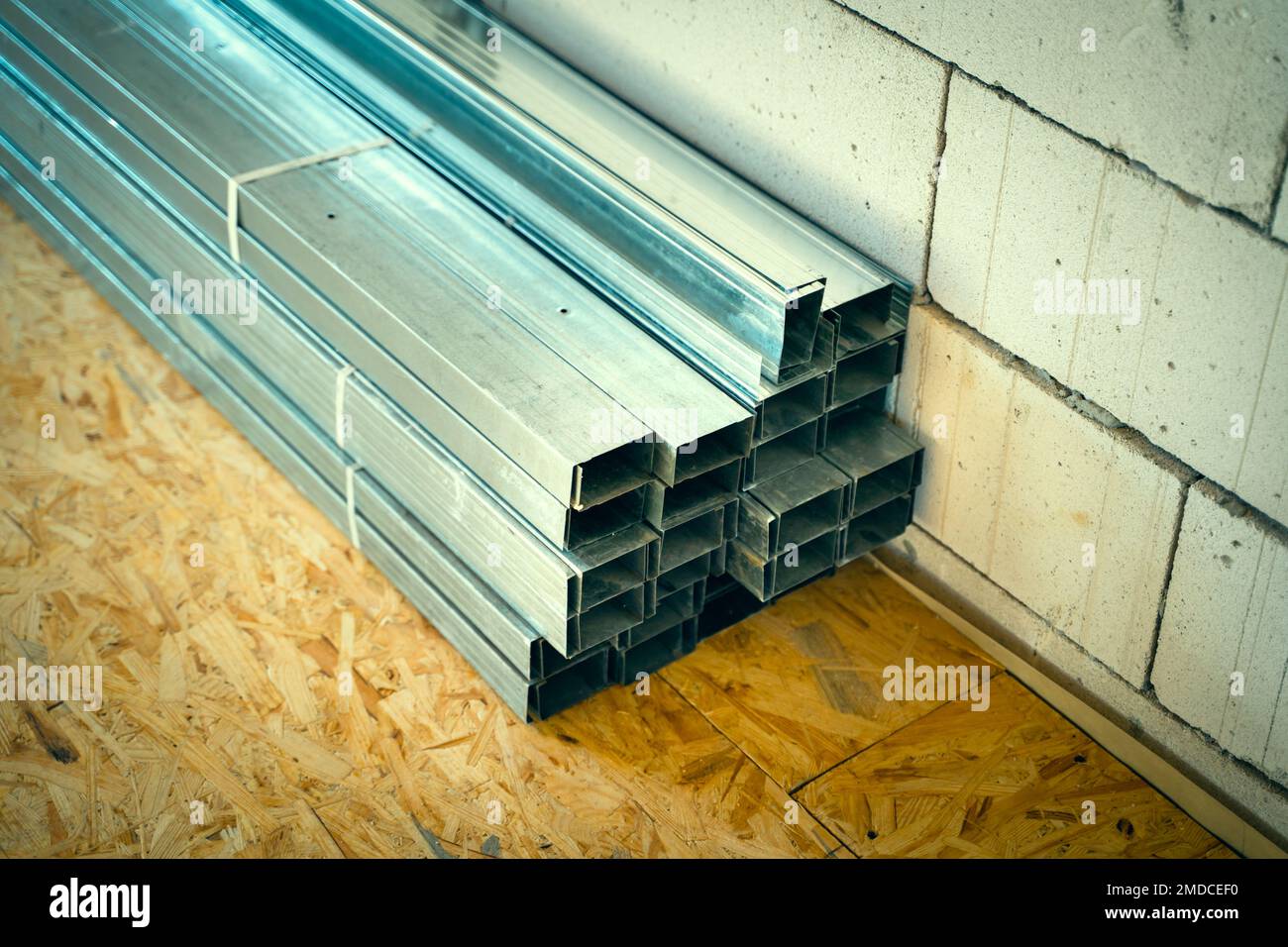 A packed metal profile lies on the floor at a construction site close ...