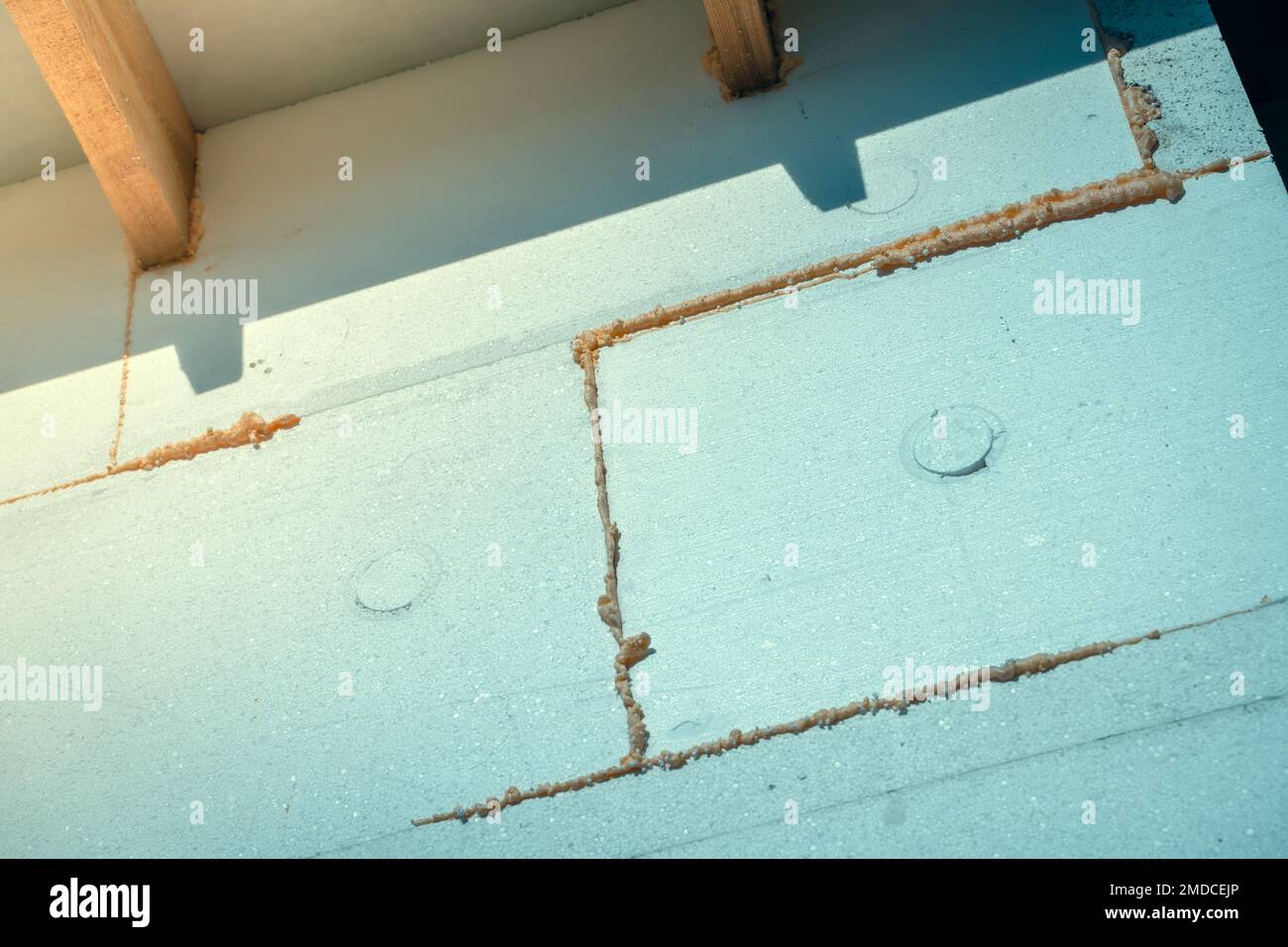 The wall of the house is insulated with white polystyrene foam ...