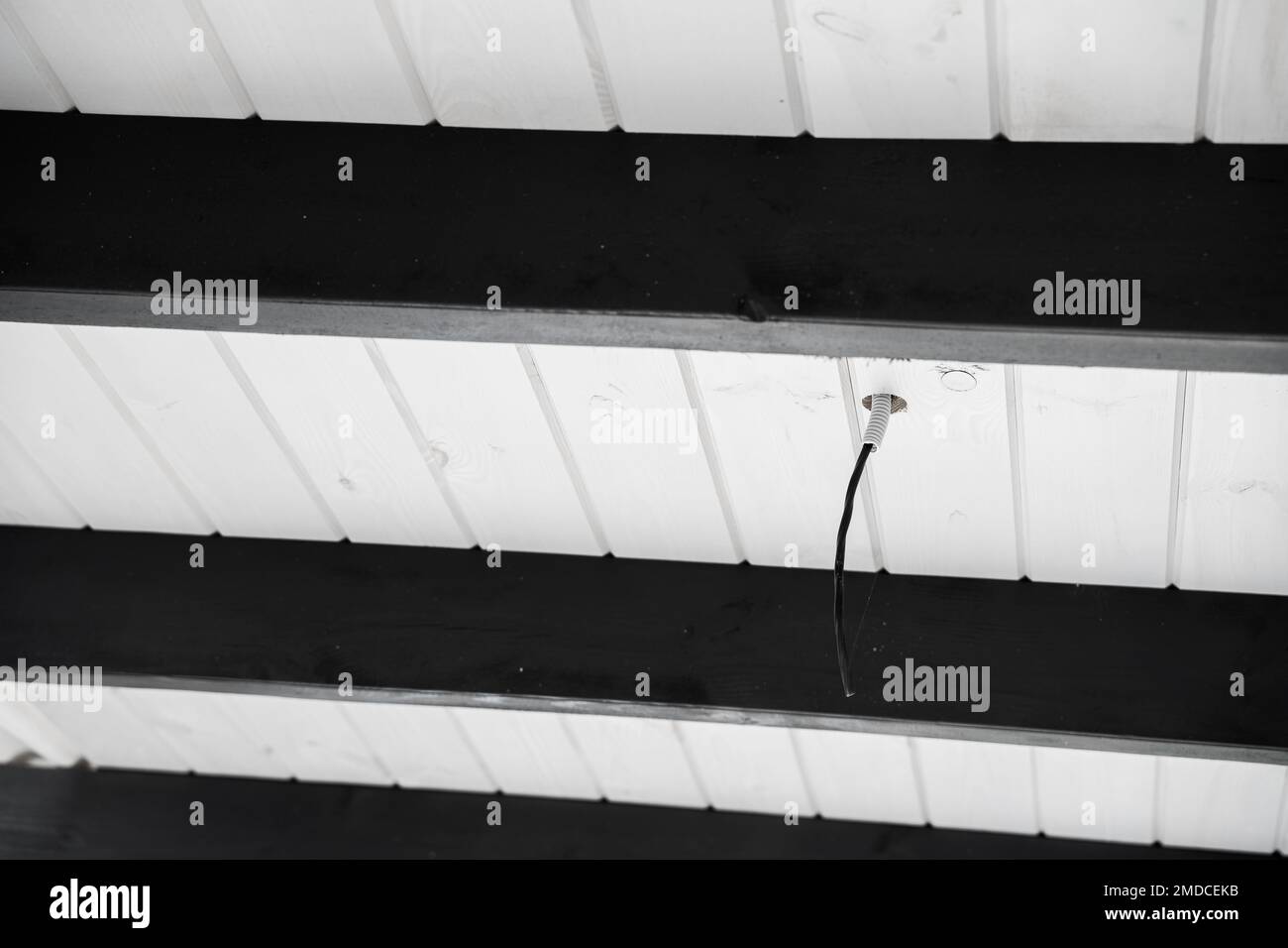 The wire for lighting is brought out through a hole in the ceiling of ...