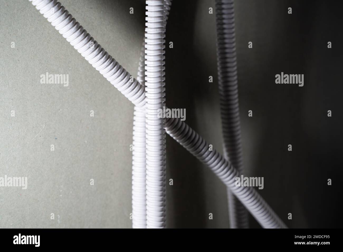 The wires in the protective corrugated pipe are held inside the ...
