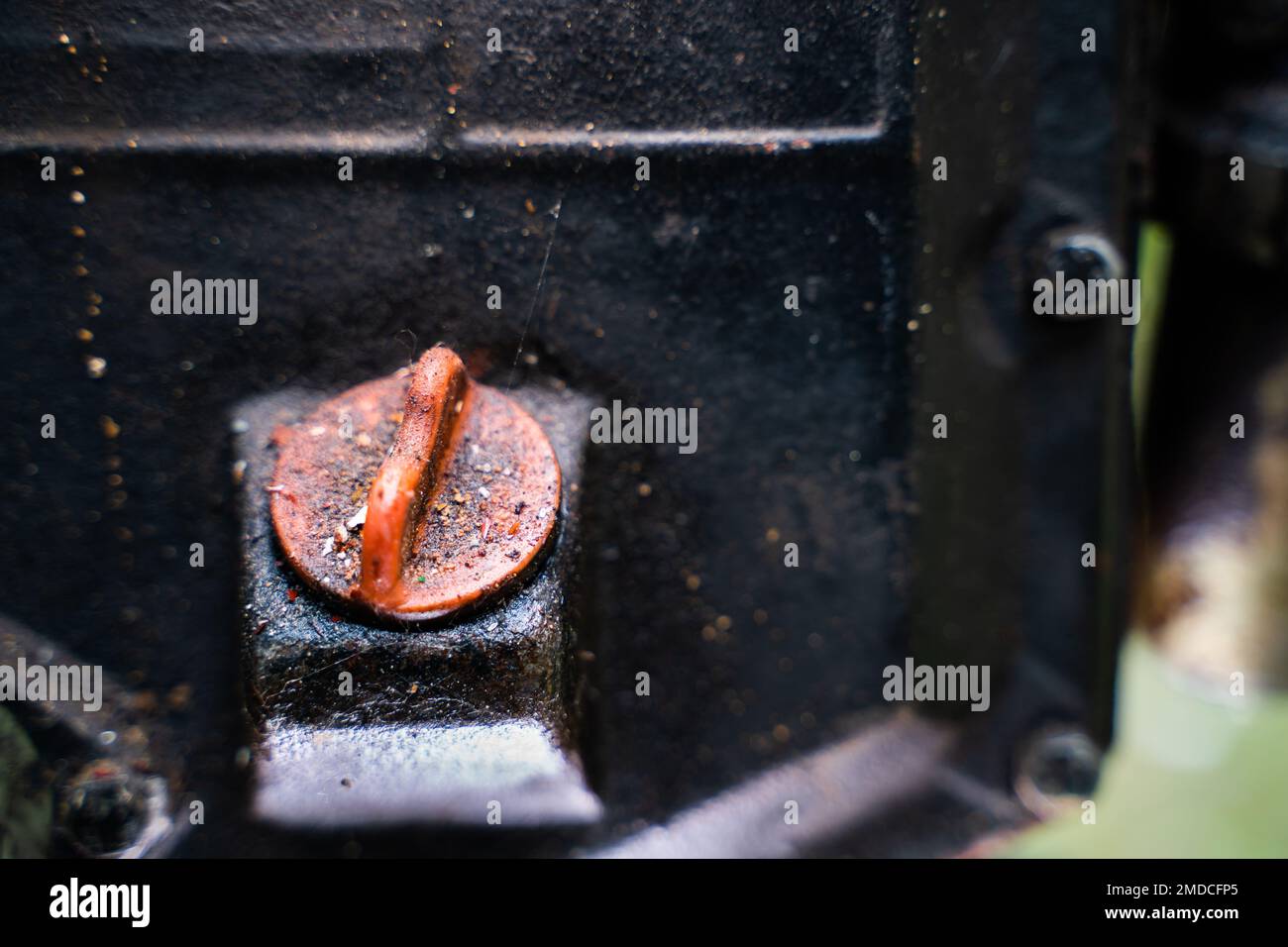 Red dirty oil dipstick cap. Filler neck for oil in a diesel engine of a ...