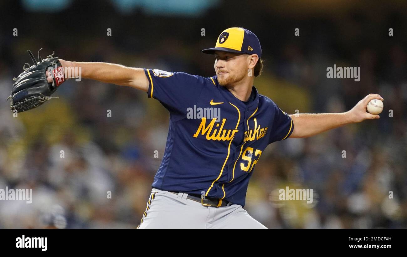 Milwaukee Brewers starting pitcher Eric Lauer throws during a baseball ...
